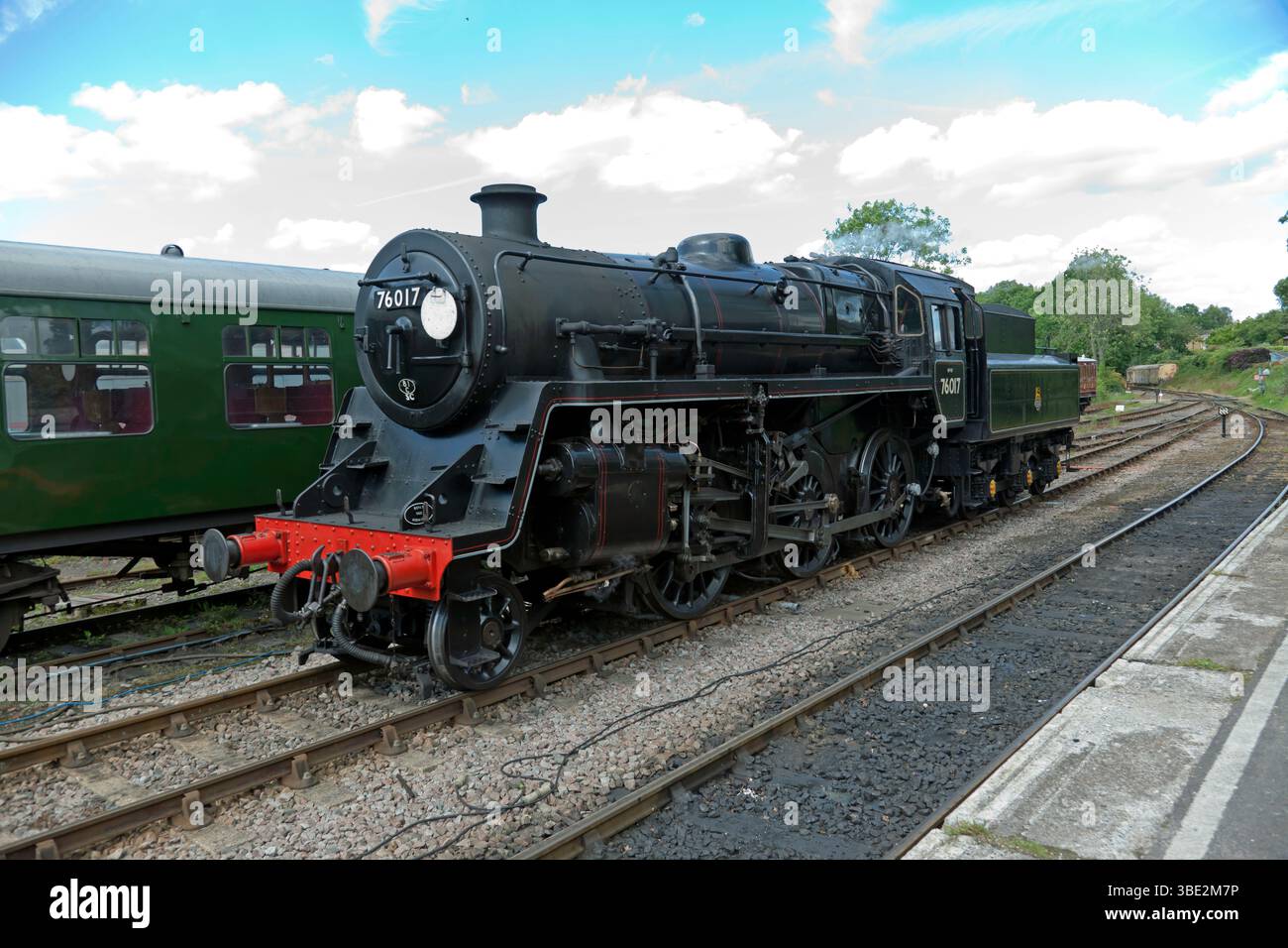 Steam Locomotive No 76017, de-coupled from the train, at Bodium Station ...