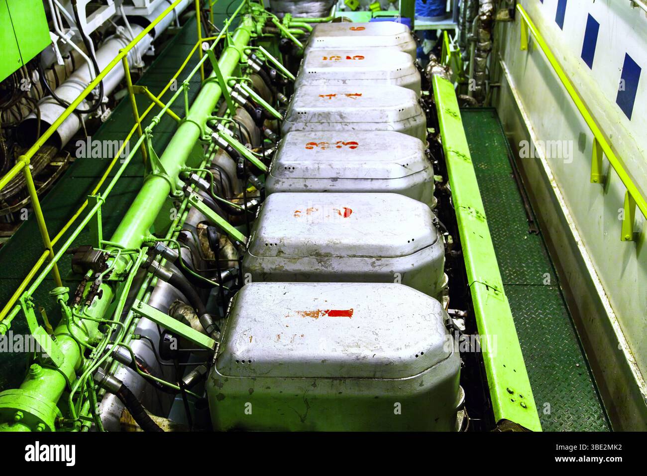 A six-cylinder main engine on board a ship in the engine room Stock ...