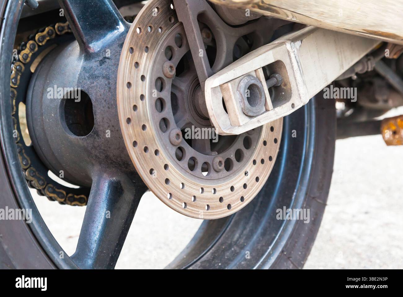 The rear wheel of a powerful sports motorcycle Stock Photo - Alamy