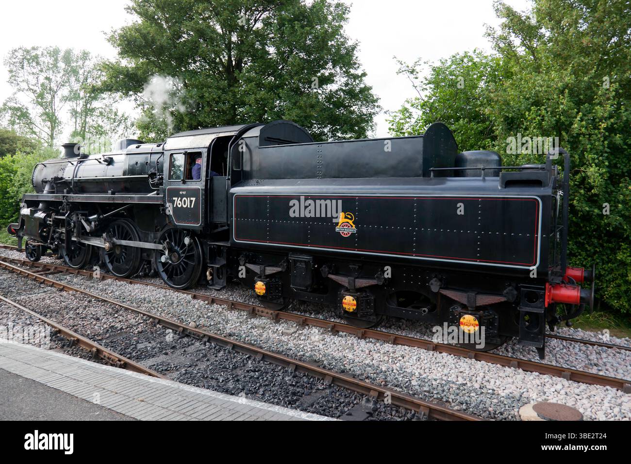 Steam Locomotive No 76017, de-coupled from the train, at Bodium Station ...