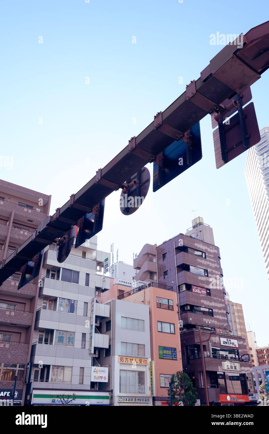 Overhead traffic signs cut across the pale Tokyo sky Stock Photo - Alamy