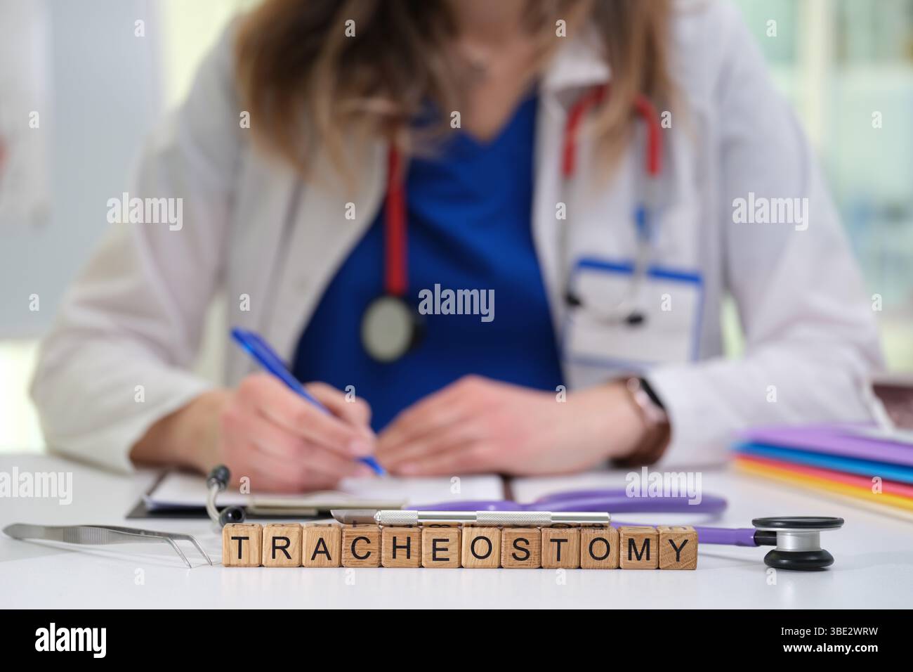 A skilled medical professional is expertly performing a tracheostomy in ...