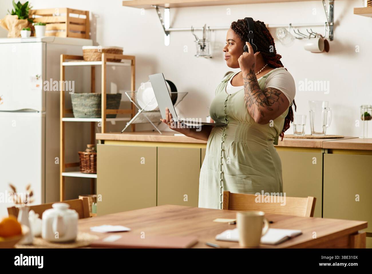 A young woman is multitasking while working remotely in her welcoming ...