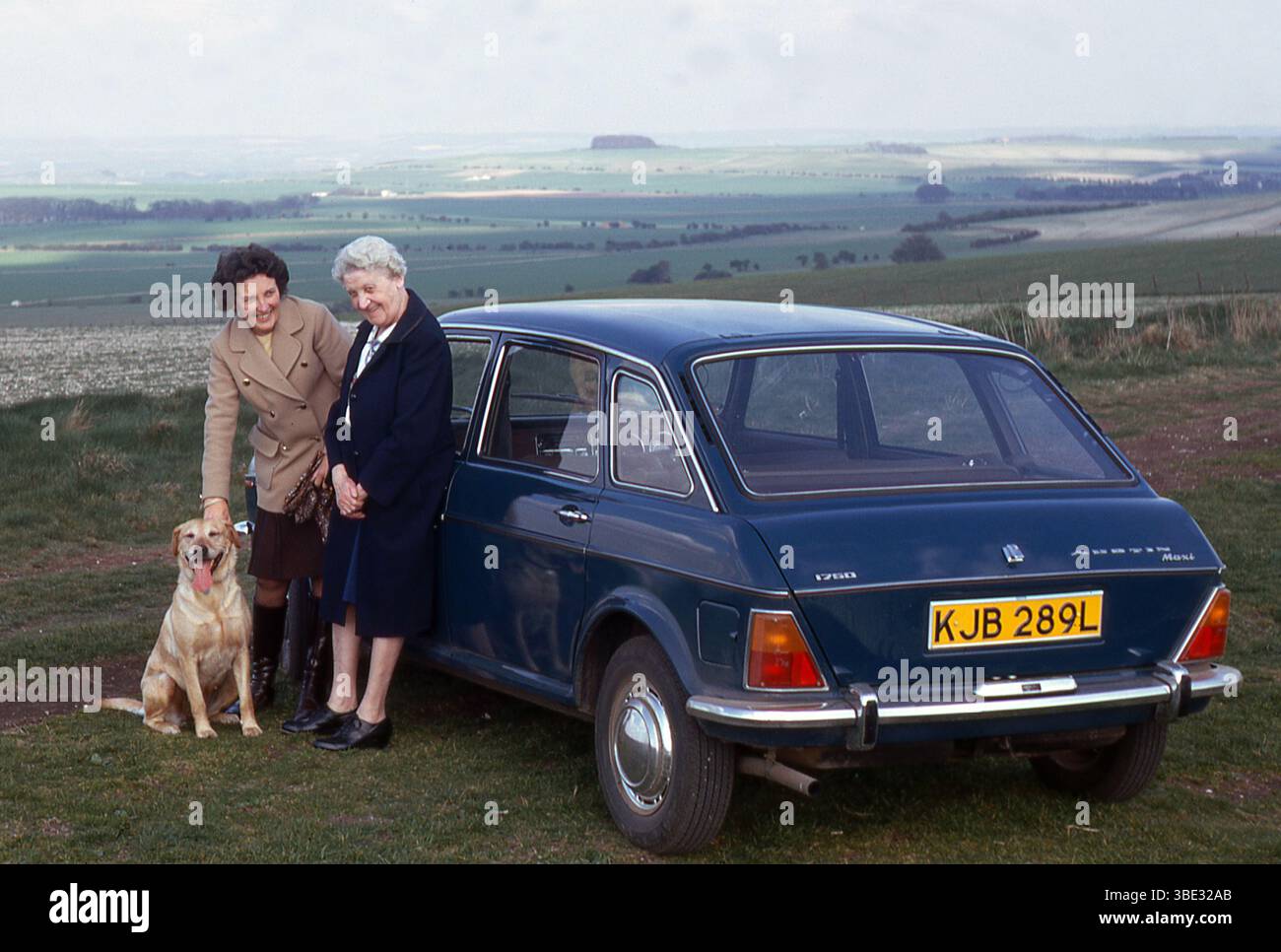 Two women standing beside an Austin Maxi 1750 car in the English ...