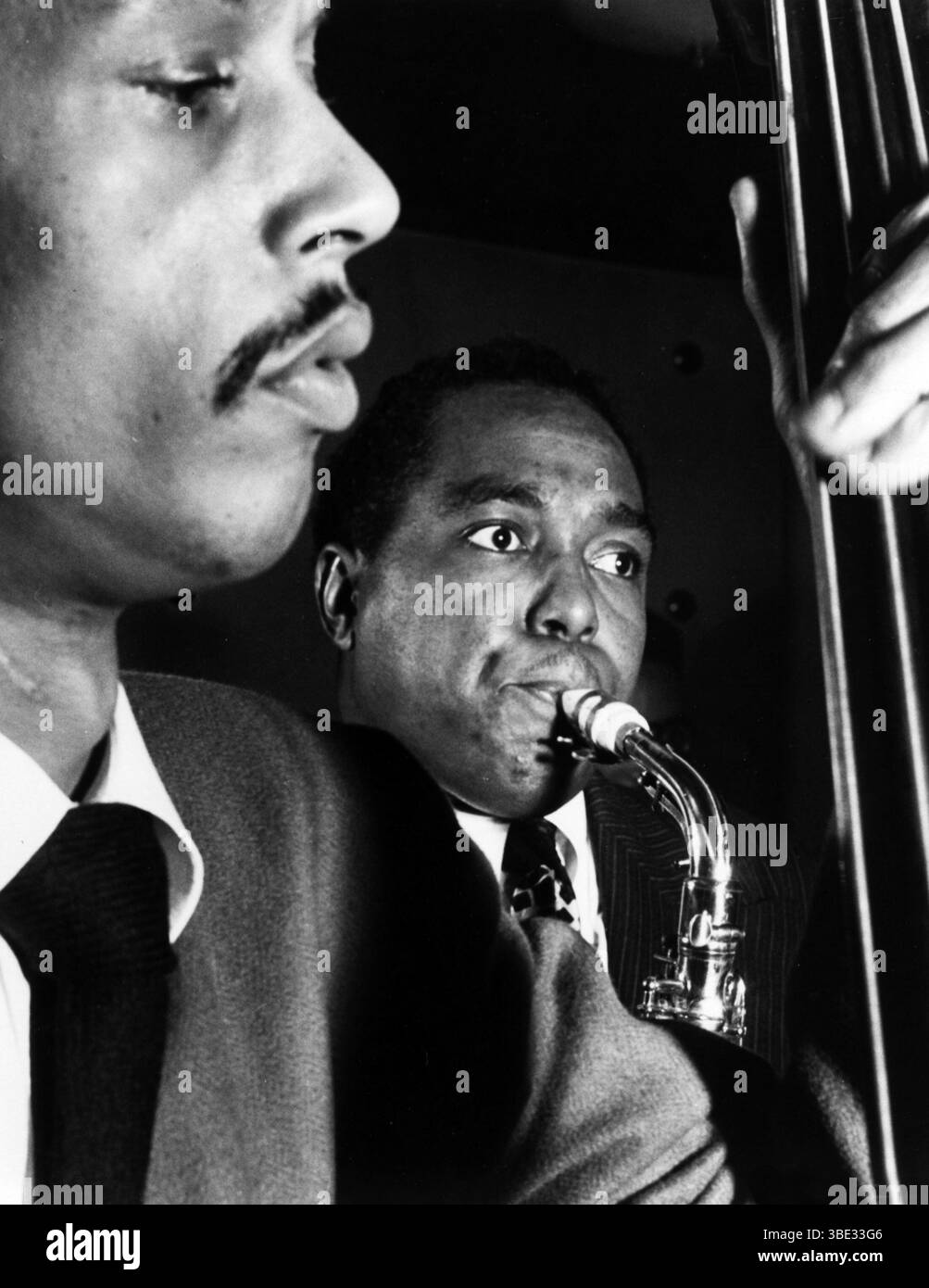 Tommy Potter playing double bass and Charlie Parker playing saxophone ...