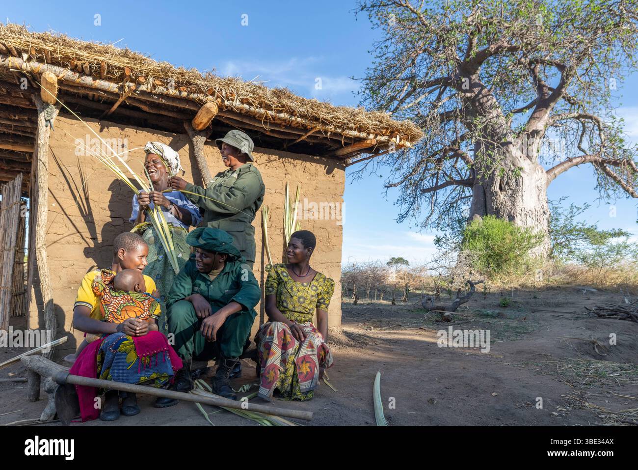 Tanzania, Simyu region, rangers laughing with villagers They are ...