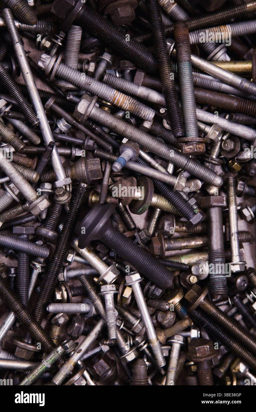 Scattered bolts and screws of different sizes forming an industrial background Stock Photo - Alamy