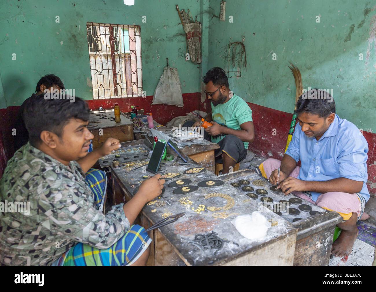 Metal worker using old lost wax casting method to create jewels, Dhaka ...