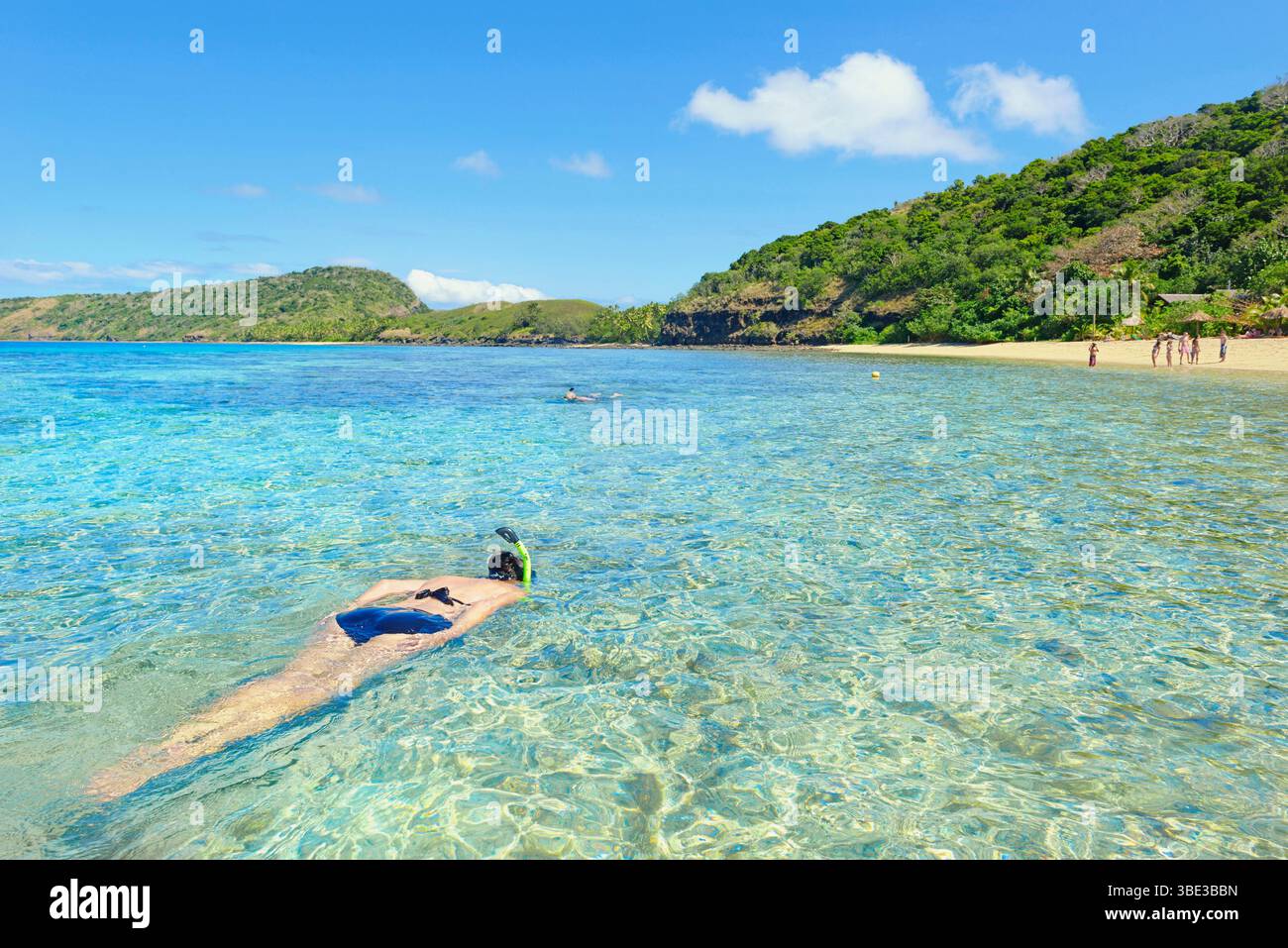 Fiji, Yasawa islands, Snorkeller swimming in Fiji islands turquoise ...