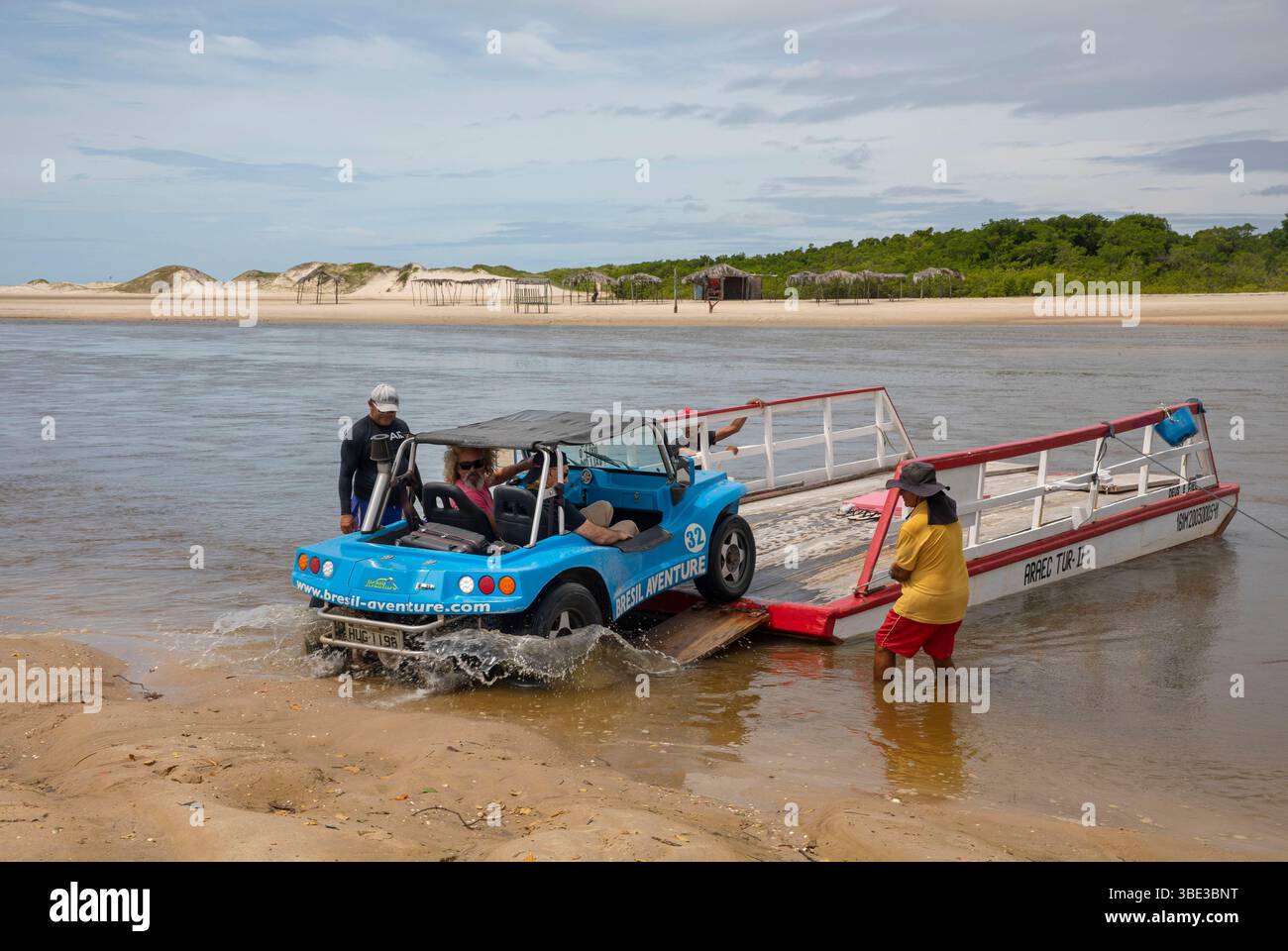 Brazil, Nordeste, Ceara, colourful buggy climbing onto a tray to cross ...