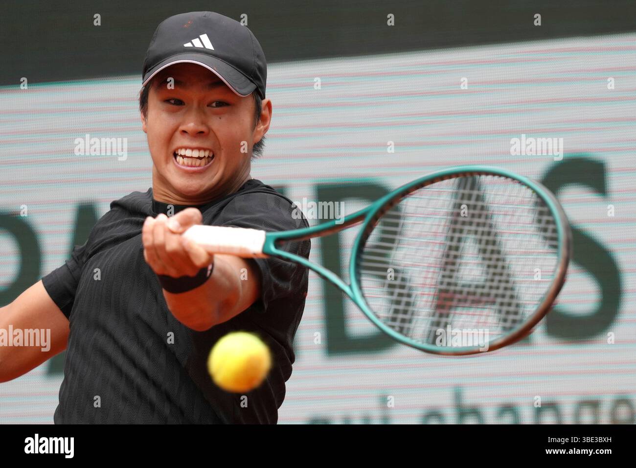 United States' Learner Tien returns the ball to Germany's Alexander ...