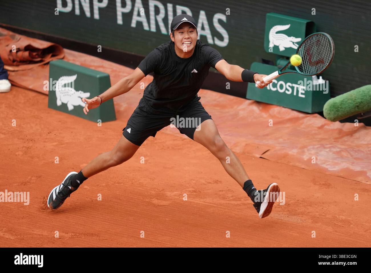 United States' Learner Tien returns the ball to Germany's Alexander ...