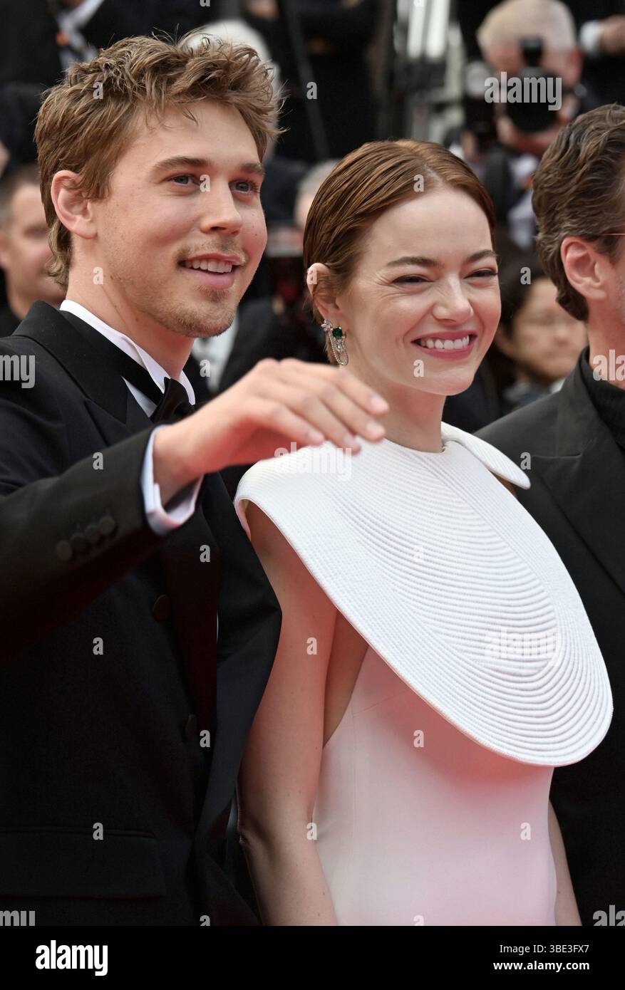 Austin Butler (in Saint-Laurent), Emma Stone (in Louis Vuitton ...