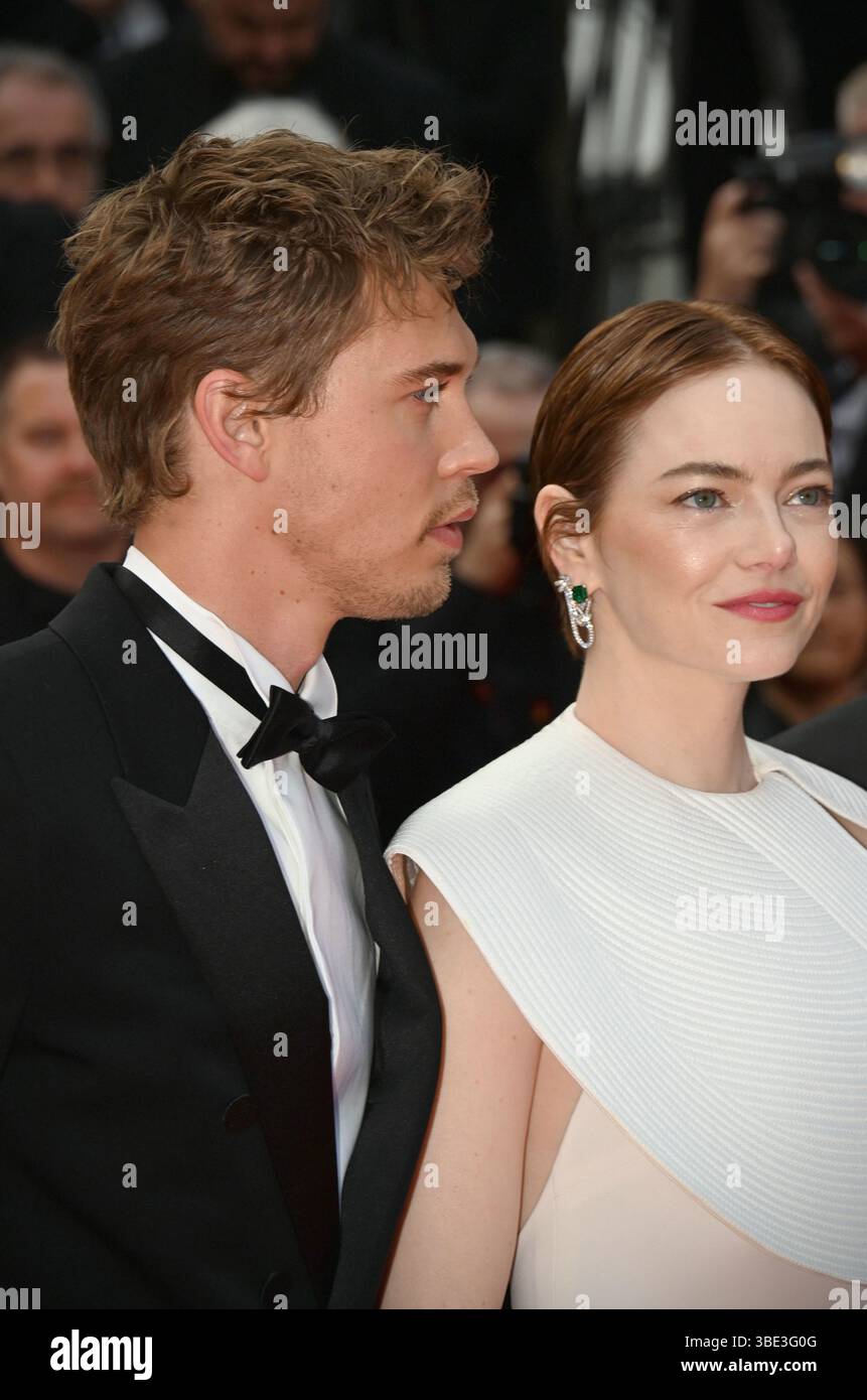 Austin Butler (in Saint-Laurent), Emma Stone (in Louis Vuitton ...