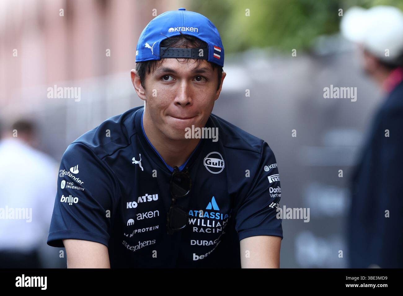 Alexander Albon of Williams Racing looks on in the Paddock during the ...
