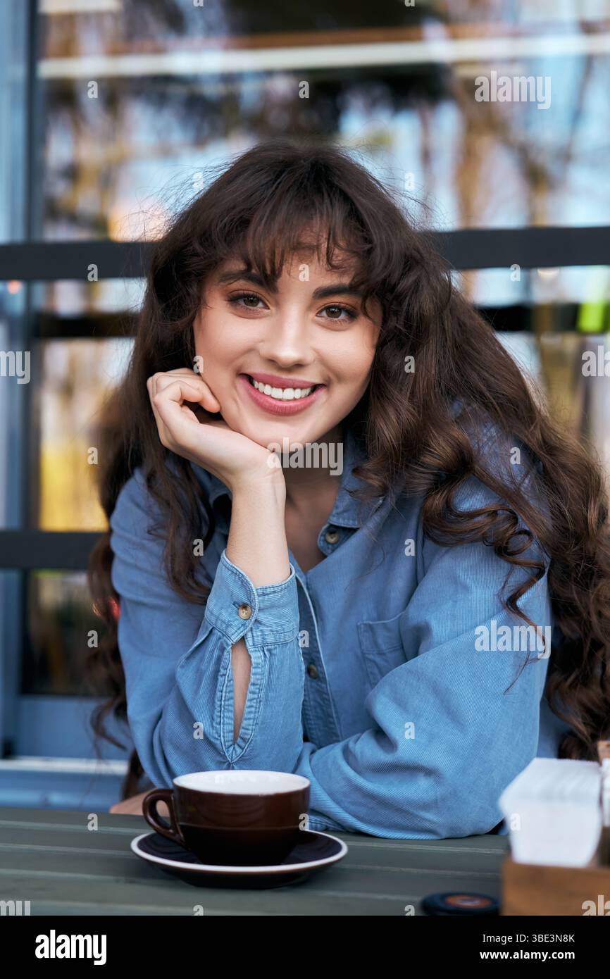 young woman having a delightful moment in a vibrant cafe setting Stock ...