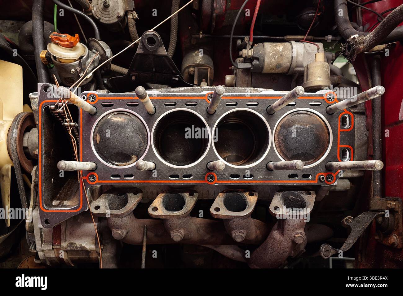 Disassembled inline 4 cylinder engine top view. Head and gasket removed ...