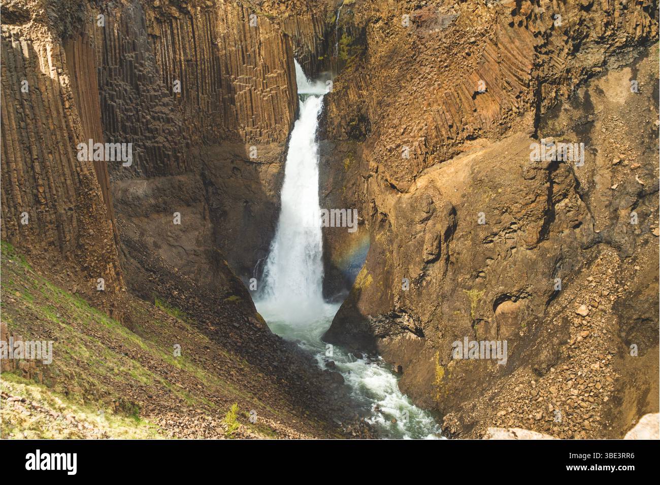 Litlanesfoss waterfall cascades between basalt columns in East Iceland ...
