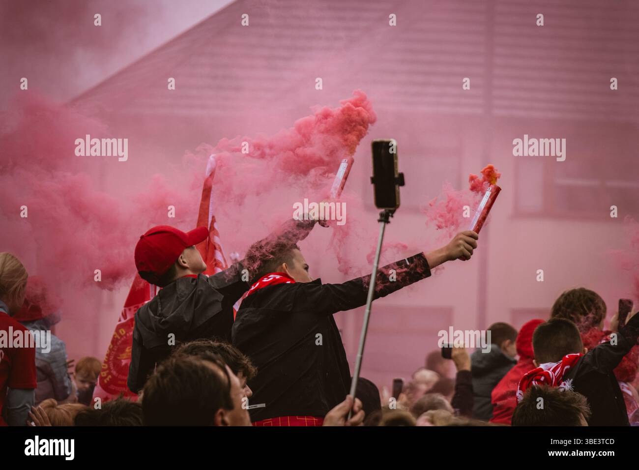 Liverpool fans with red smoke bombs on Queens Drive near Allerton Maze ...