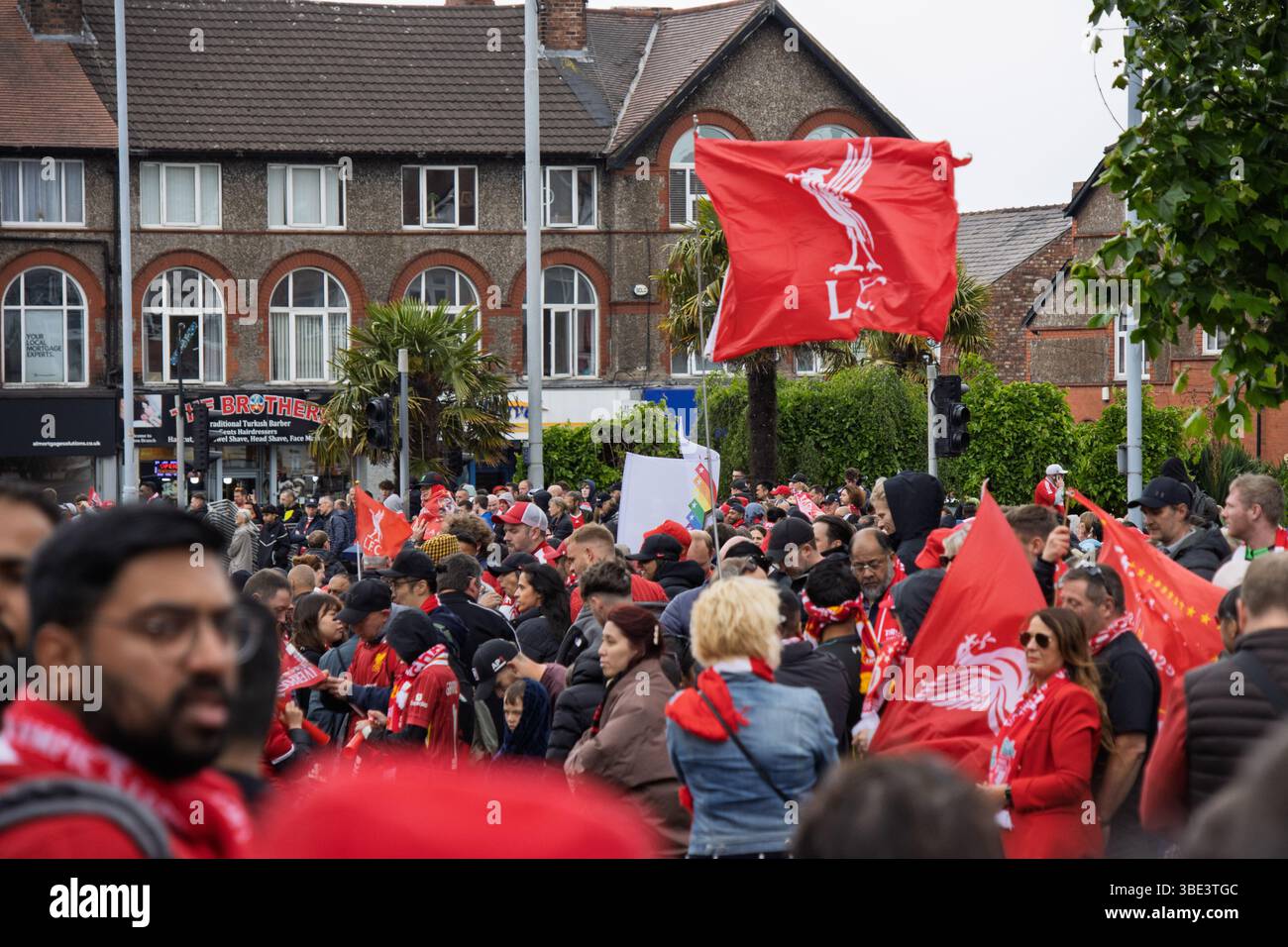 A crowd of Liverpool fans waving a flag at Allerton Maze on Queens ...
