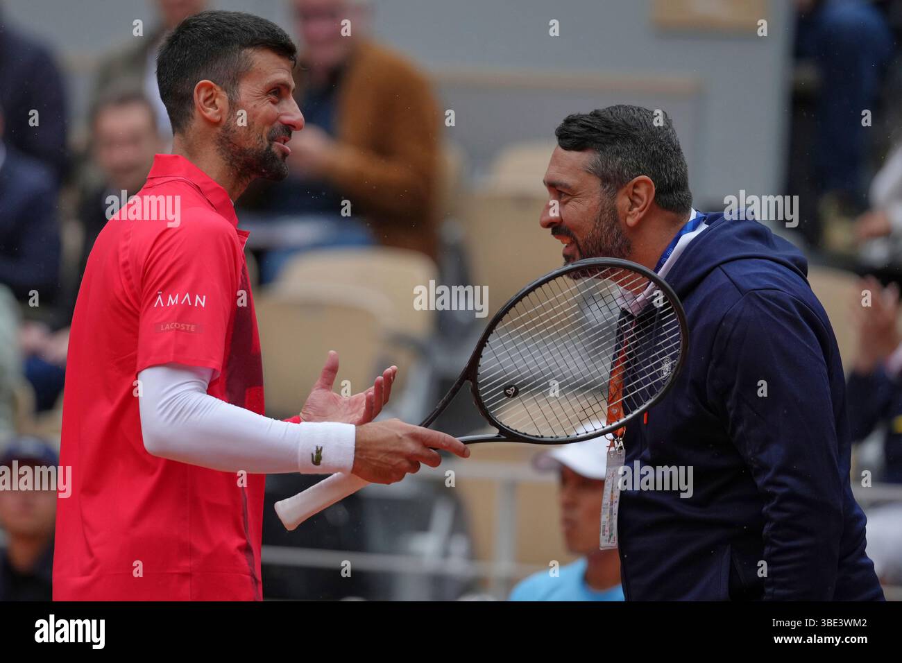 Serbia's Novak Djokovic talks with a judge as he plays Mackenzie ...