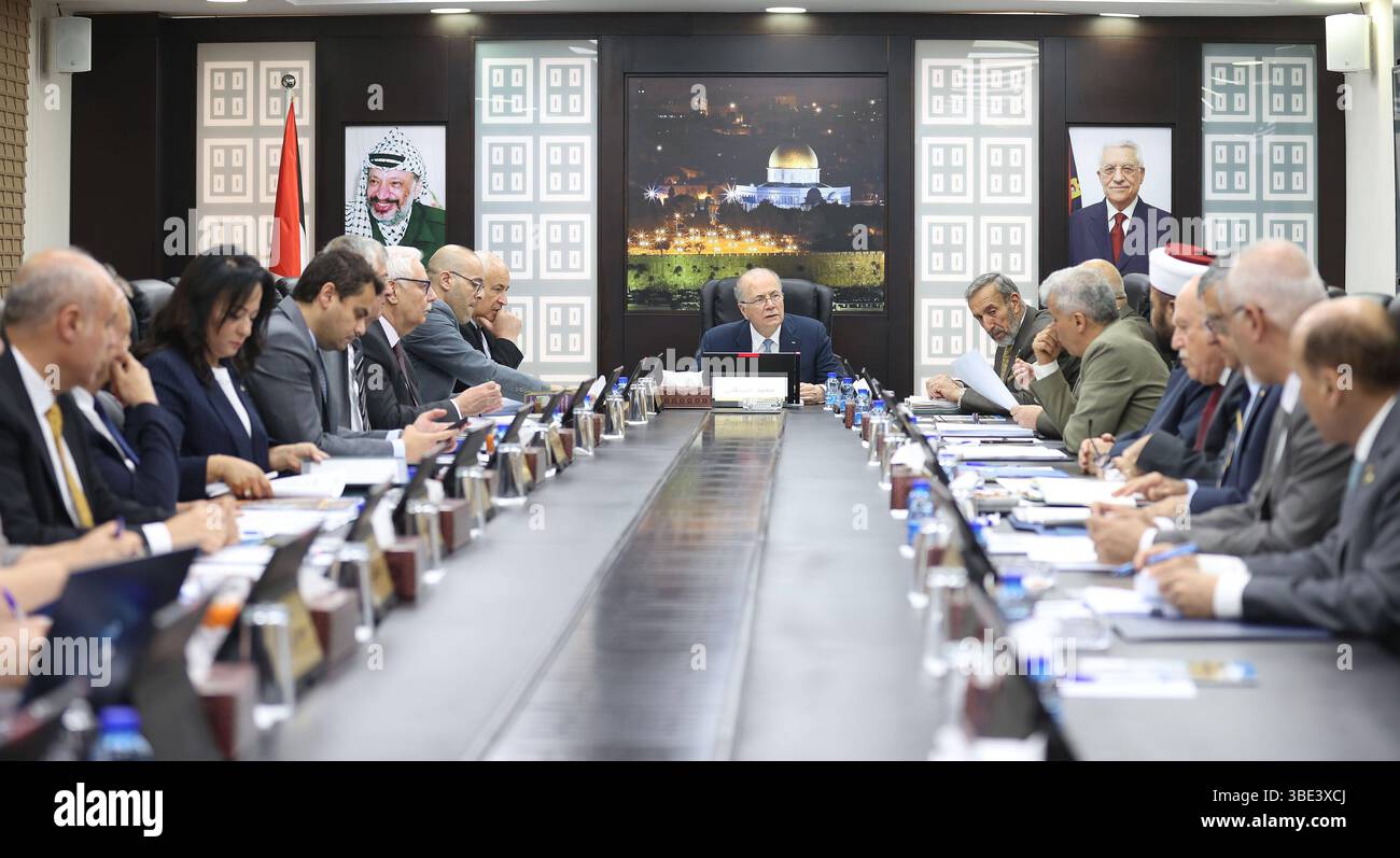 Palestinian Prime Minister Mohammad Mustafa chairs the weekly session ...
