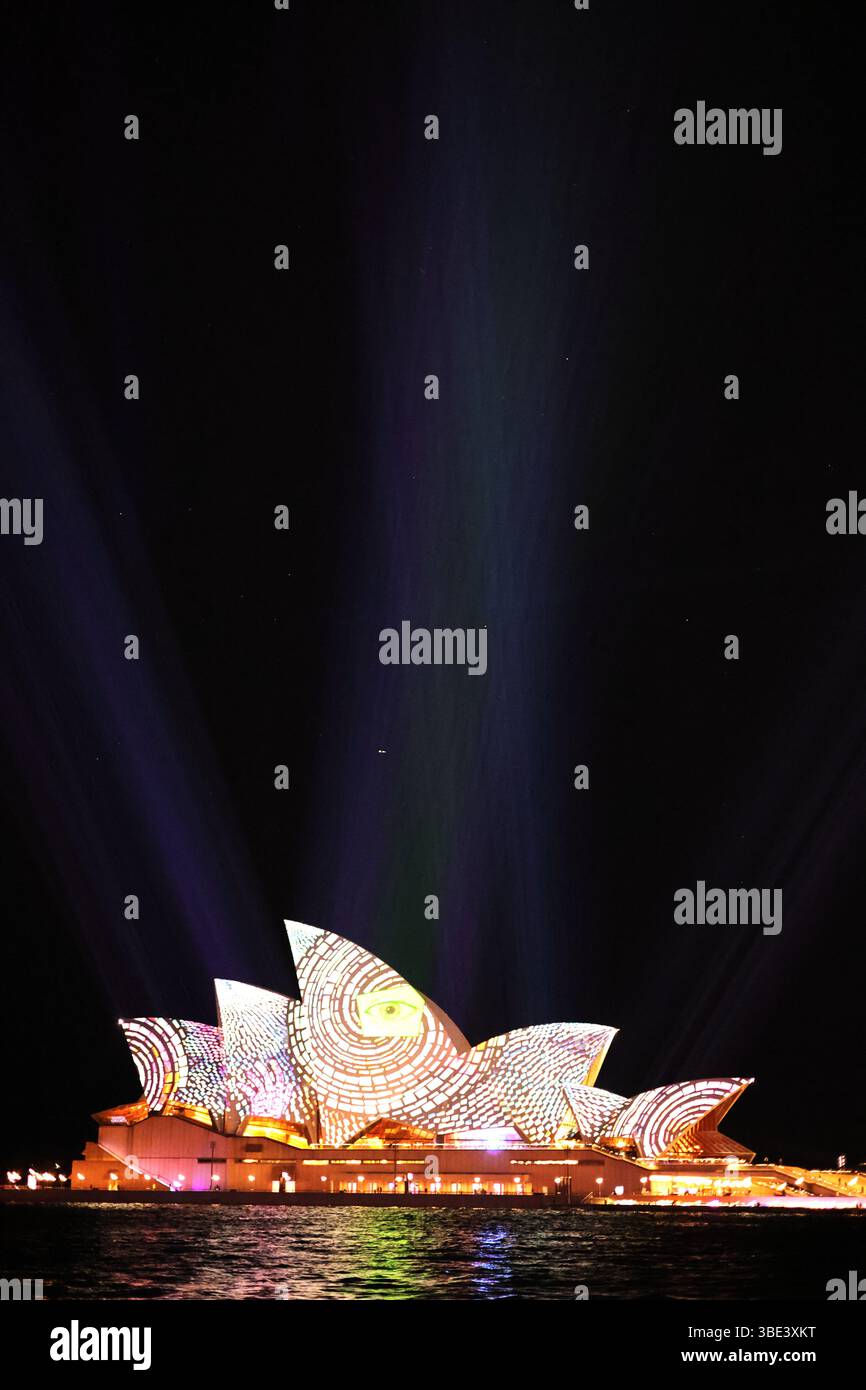 Vivid Festival 2025 - Sydney Opera House with searchlights Stock Photo ...