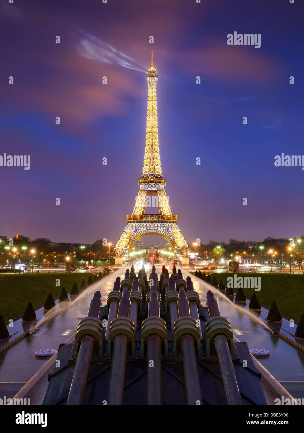 The Eiffel Tower illuminated at night and beacon. Trocadero, Champs-de ...
