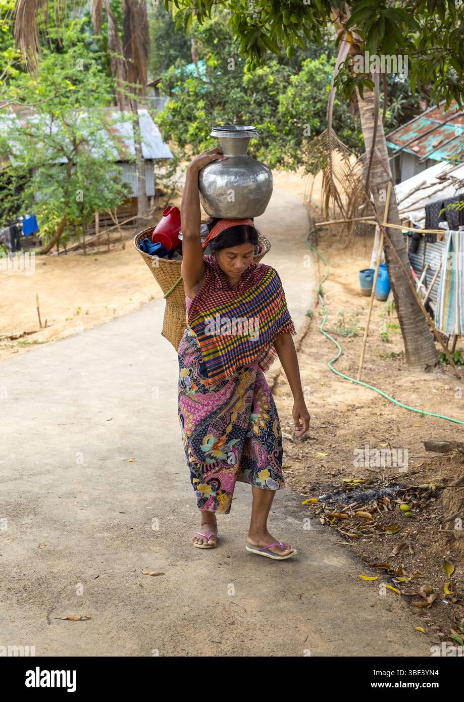 Bangladeshi woman carrying pot on her head, Chittagong Division ...
