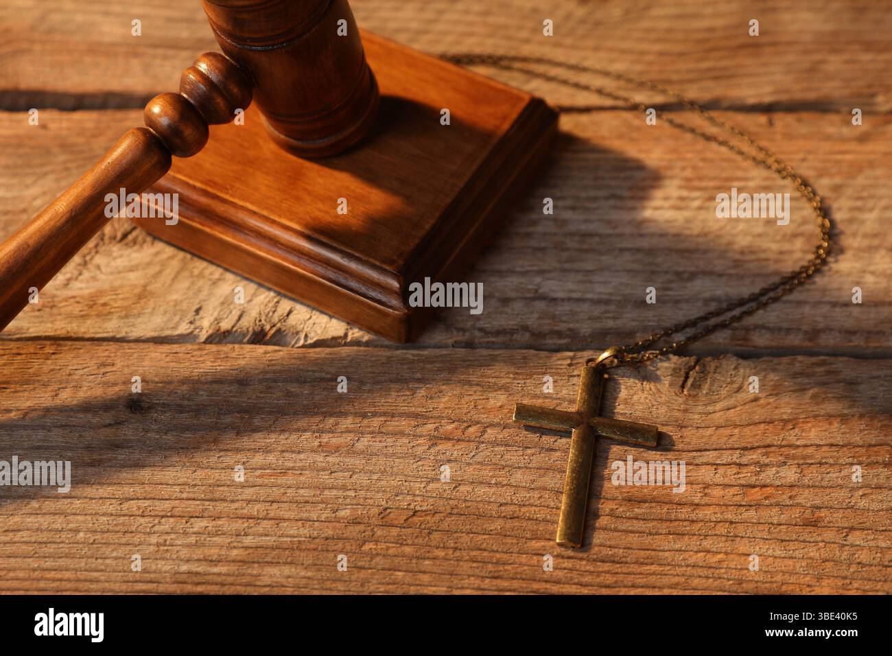 Judge's gavel and cross on wooden table, above view Stock Photo - Alamy