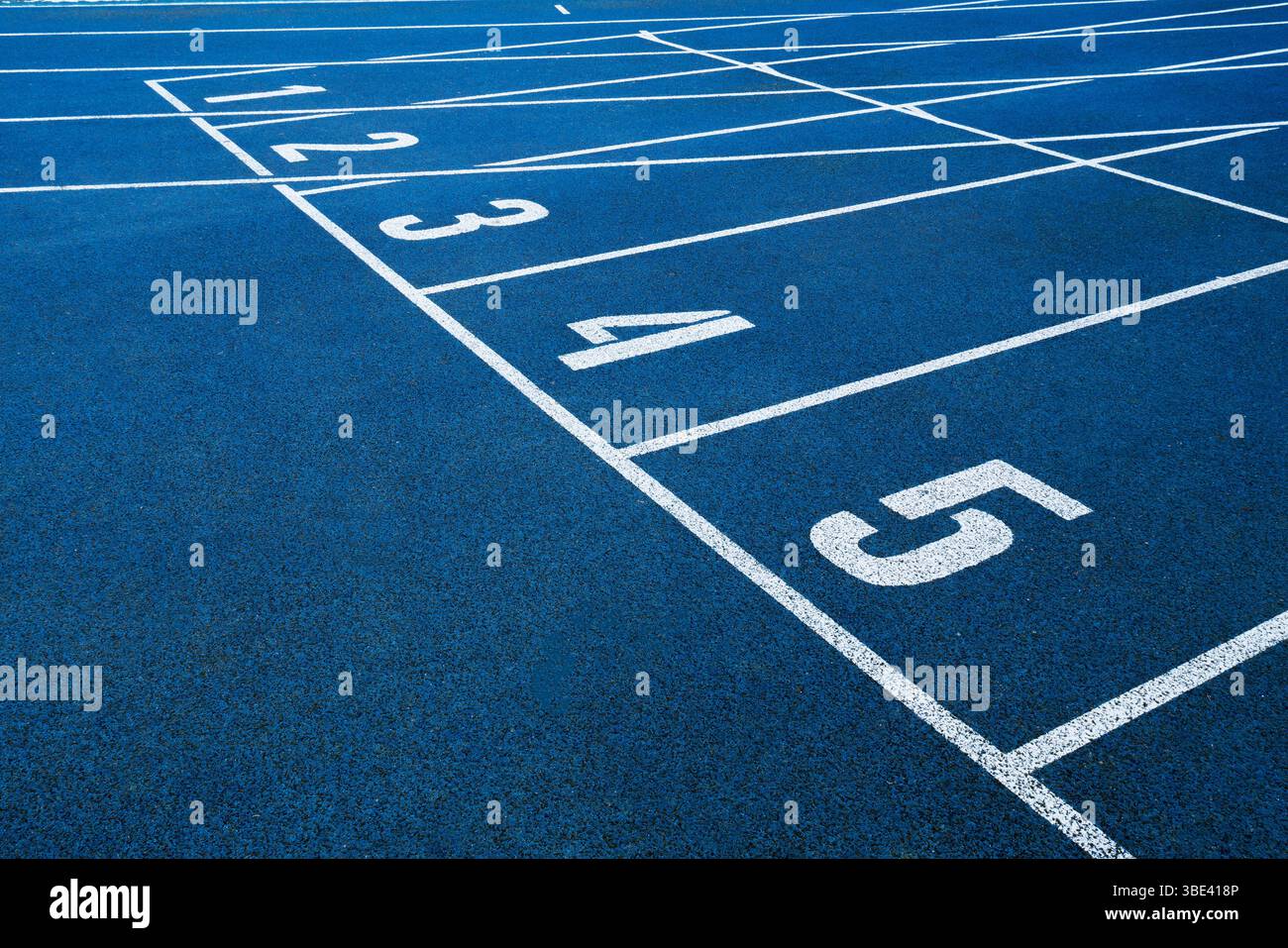 White numbers on blue rubber running track, fitness training, running ...