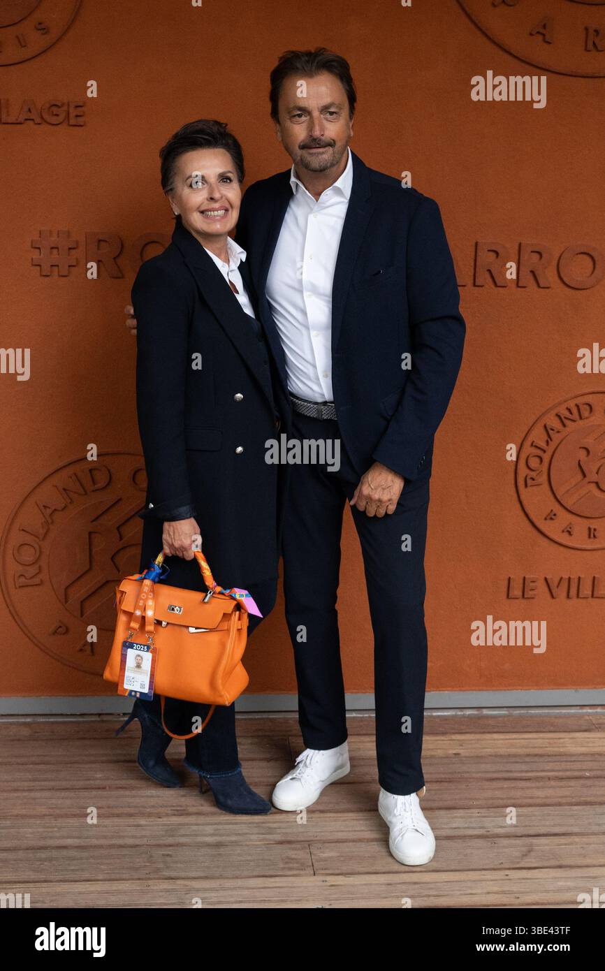 Henri Leconte and Maria Dowlatshahi take a pose at Roland Garros for ...