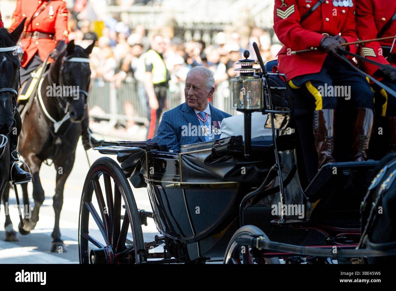 King Charles travels by Canada's State Landau towards the Senate of ...