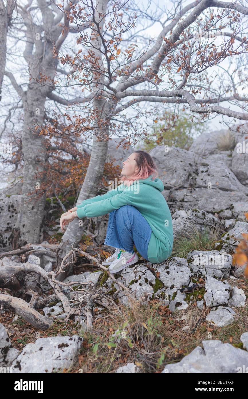 Woman in pink hoodie hi-res stock photography and images - Alamy