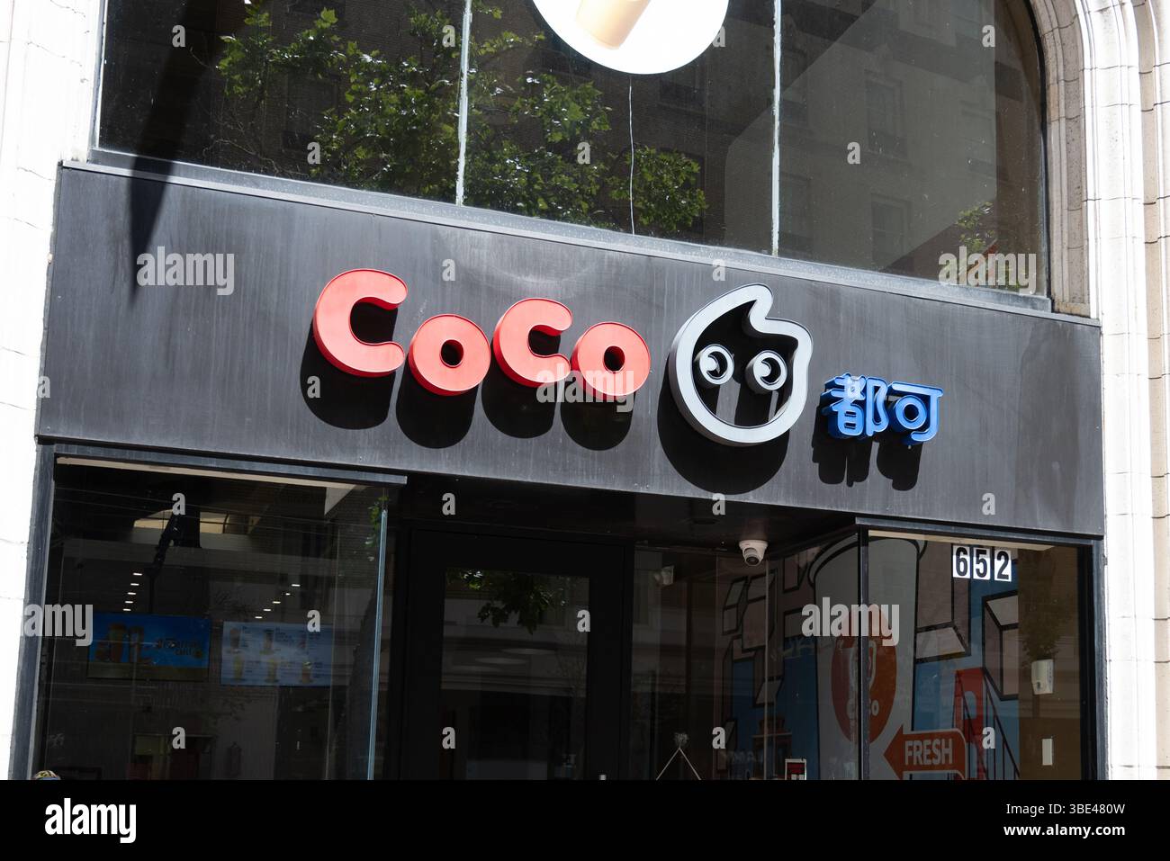 Facade of CoCo beverage shop with illuminated sign and logo, San ...