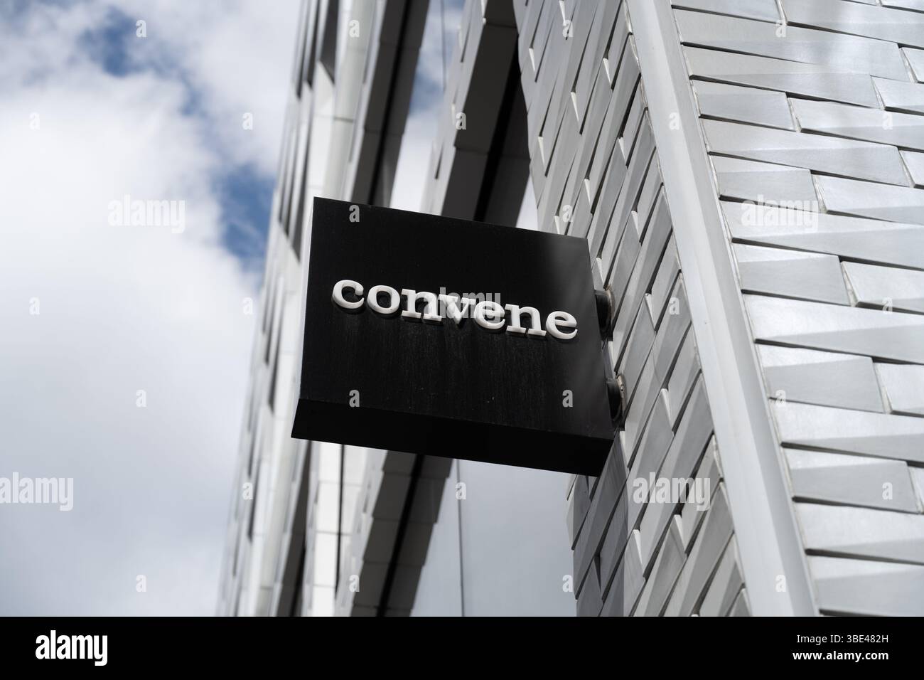Convene logo on black projecting sign attached to modern tiled office ...