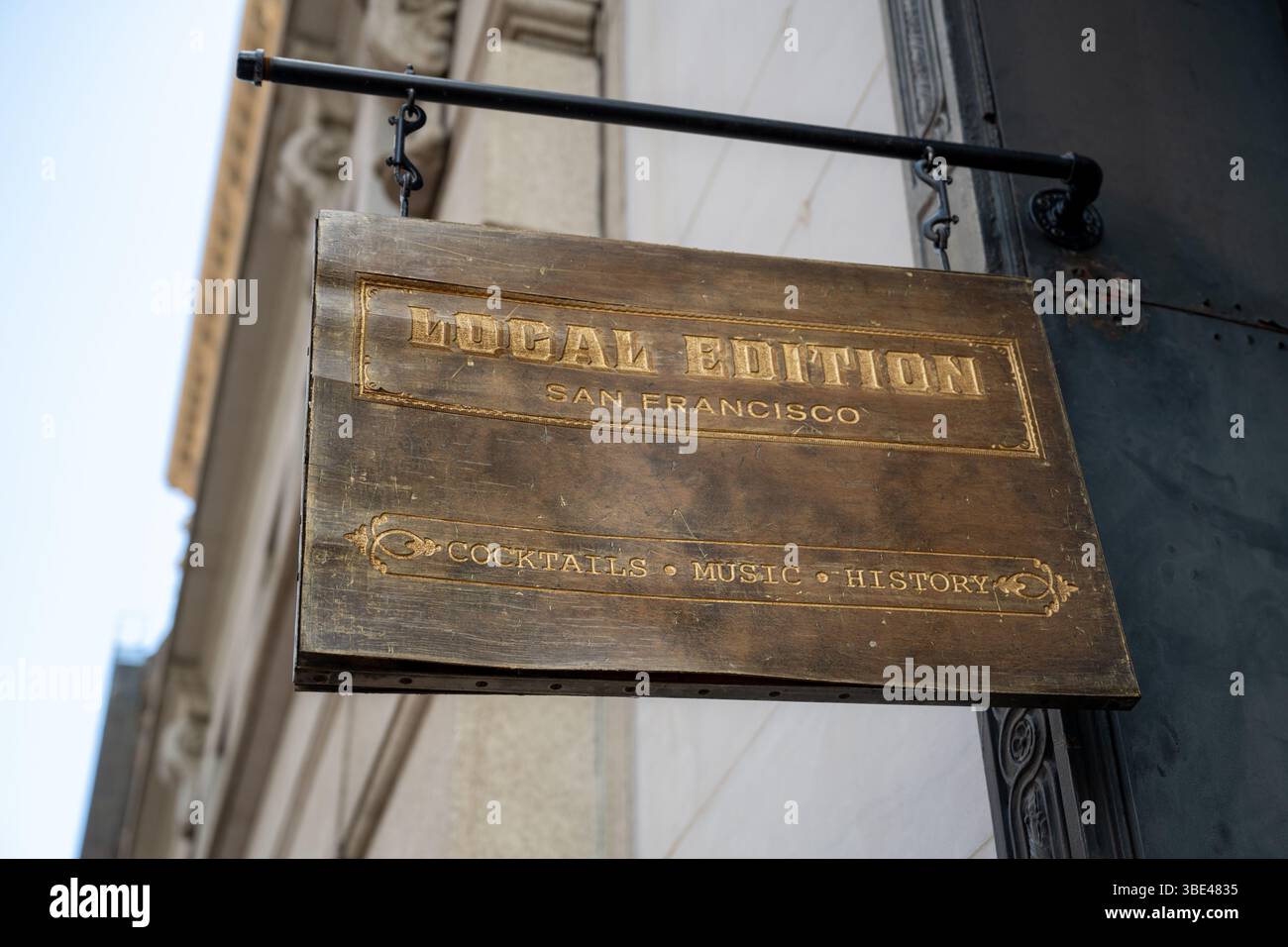 Weathered wooden hanging sign for Local Edition bar with gold lettering ...