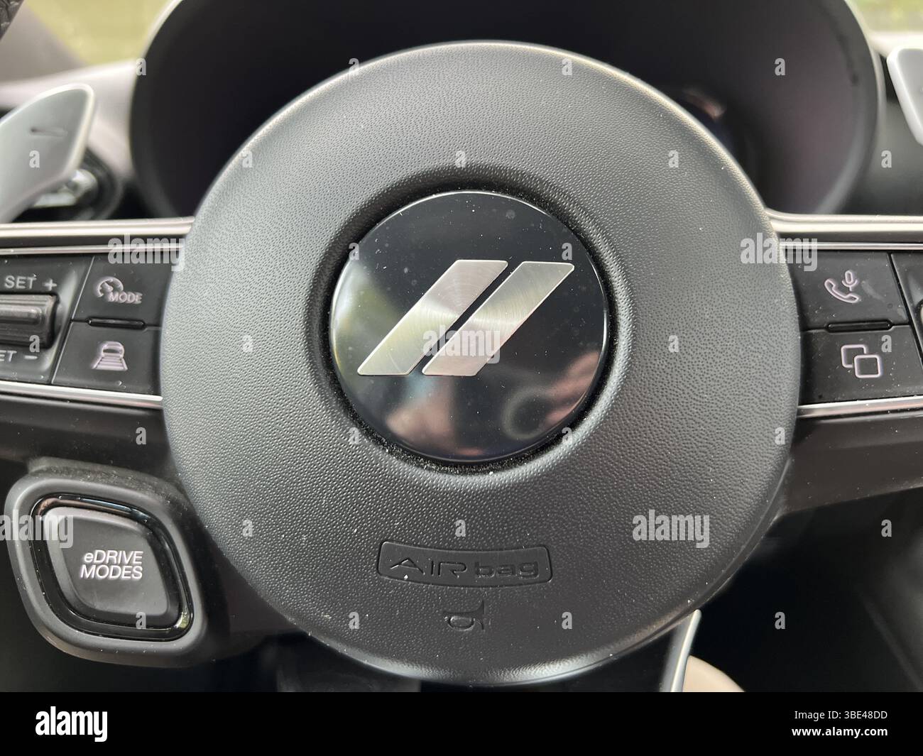 Close-up of a modern steering wheel of a Dodge Hornet automobile ...