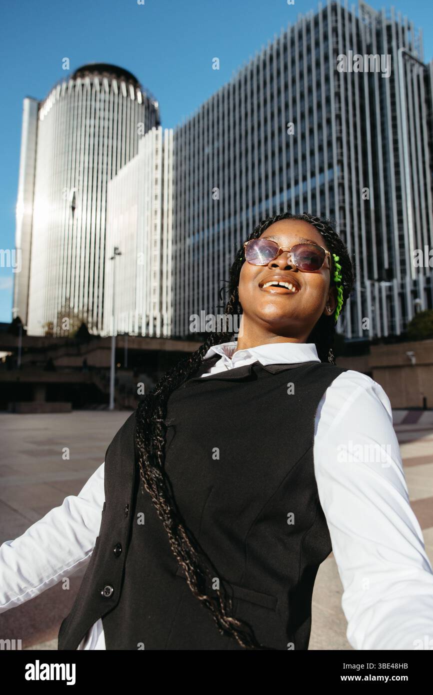 Young girl bending backward in a dance move outdoors in the city Stock ...