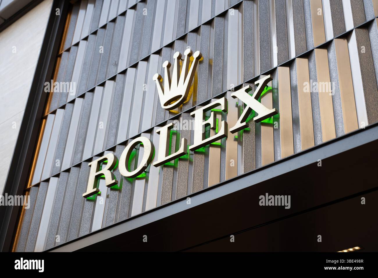 Rolex boutique facade featuring gold crown logo and lettering on ...