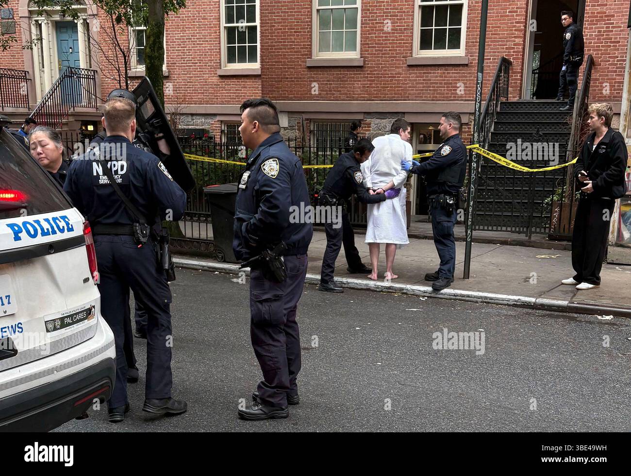 New York police officers arrest John Woeltz, Friday, May 23, 2025, in ...