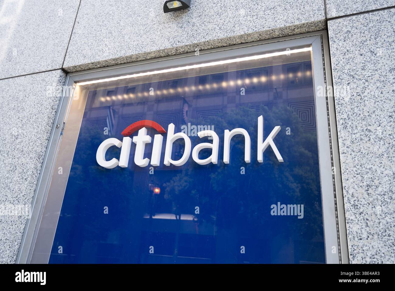 Citibank logo on blue glass storefront window at downtown branch, San ...