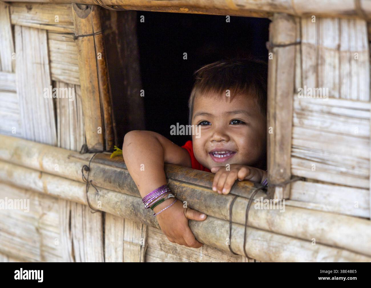 Murong ethnic group girl in the window of a bamboo house, Chittagong ...