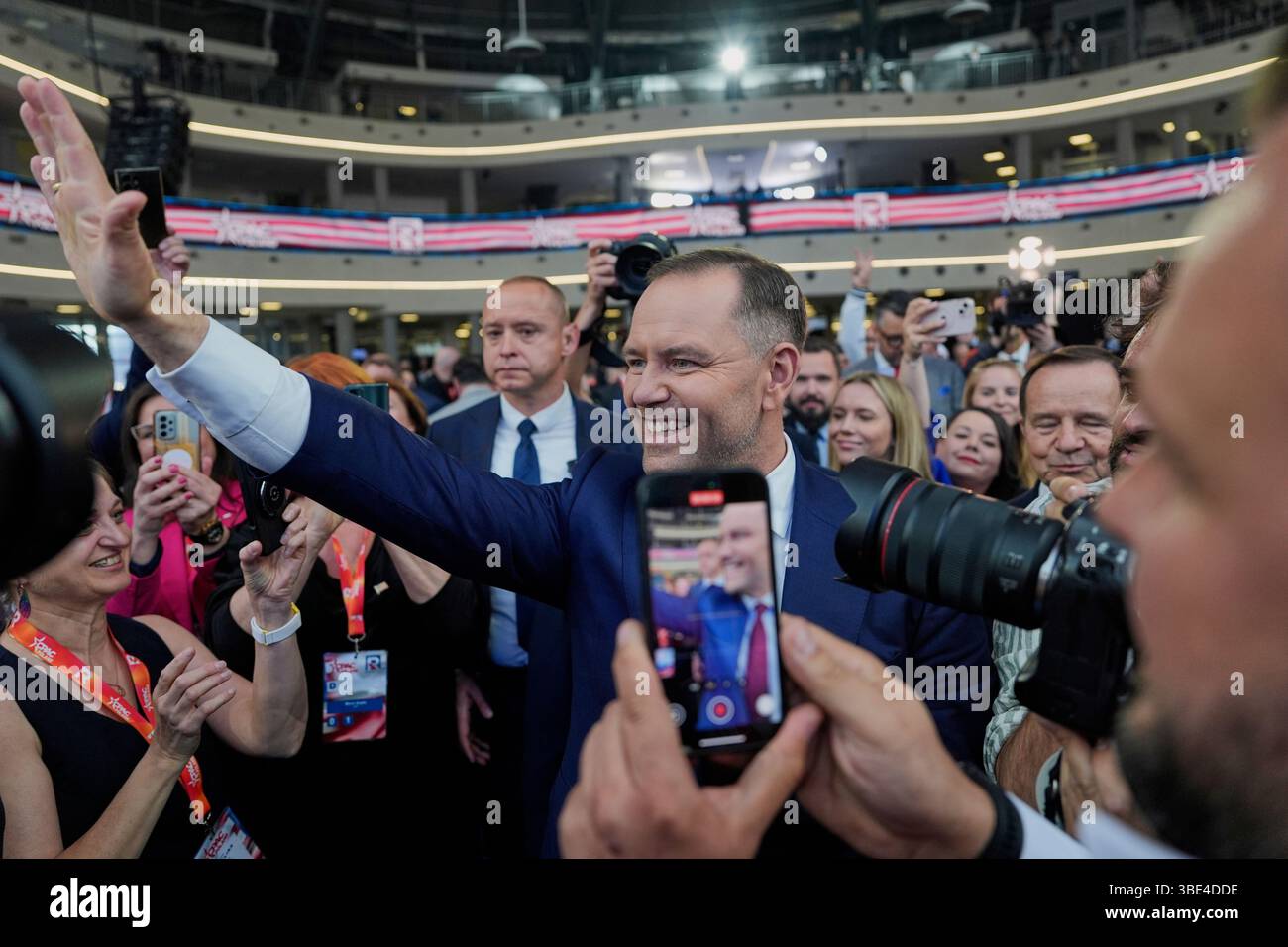 Poland's conservative presidential candidate Karol Nawrocki, center ...
