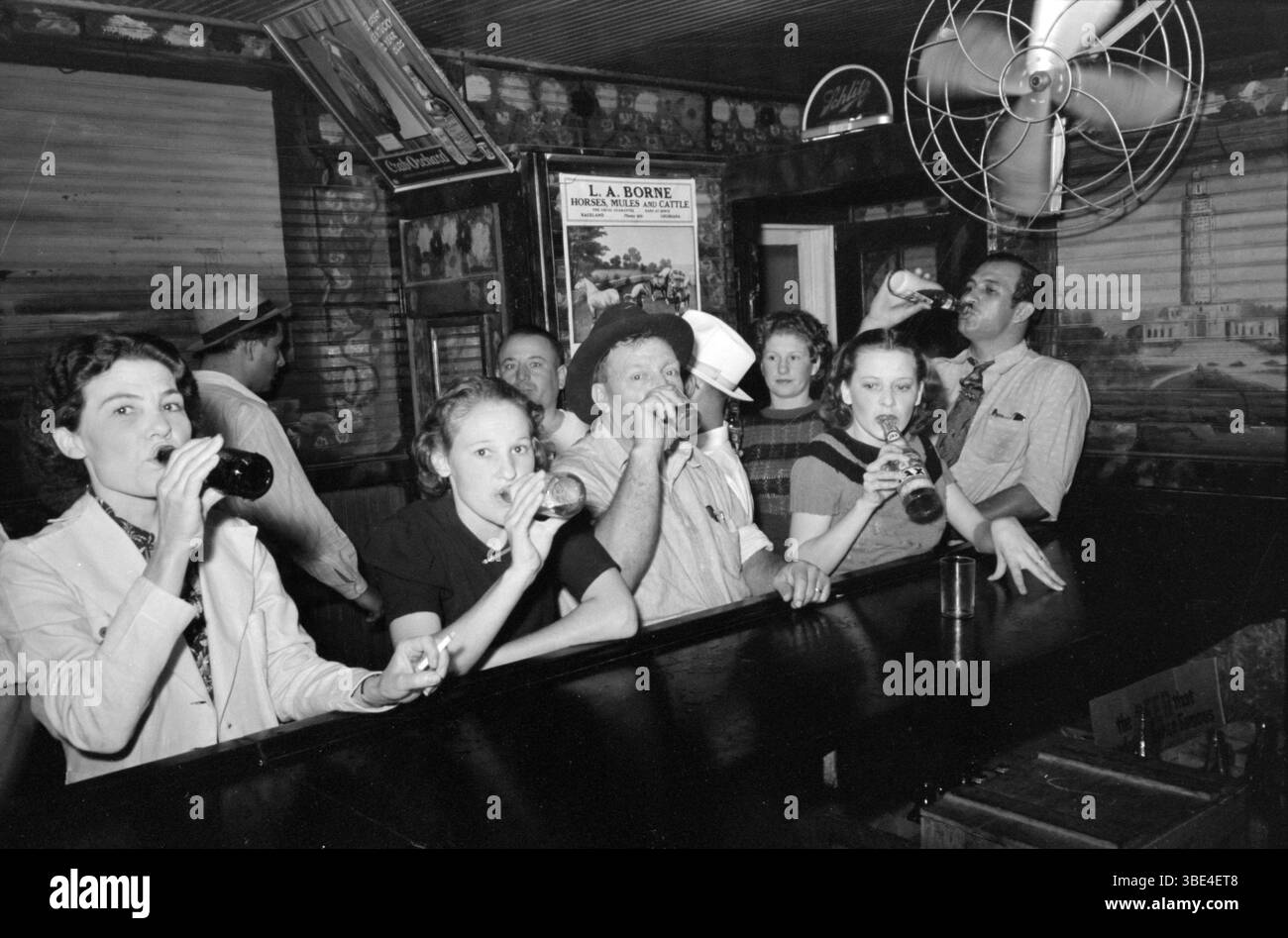 Men and women drinking beer at a bar in Raceland, Louisiana, September ...
