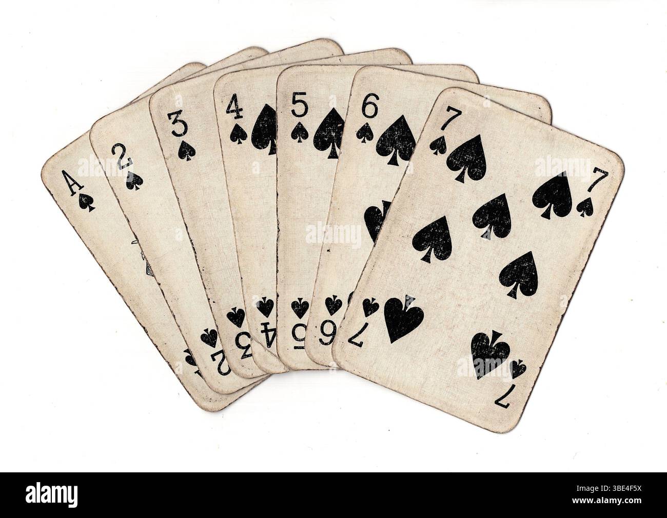 A run of seven vintage playing cards in the same suit on a white ...