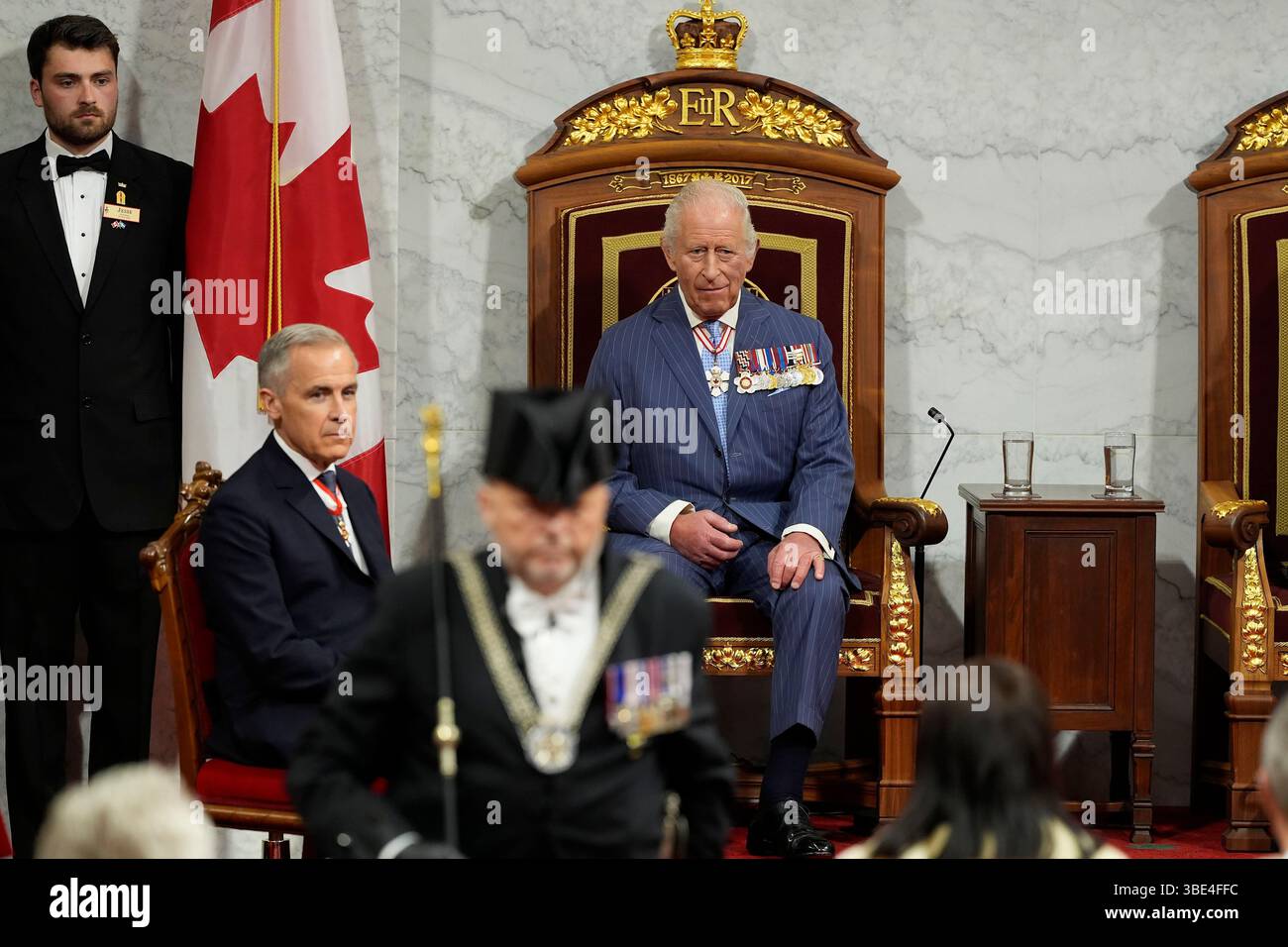 Ottawa, Canada. 27th May, 2025. Prime Minister Mark Carney, left, and ...