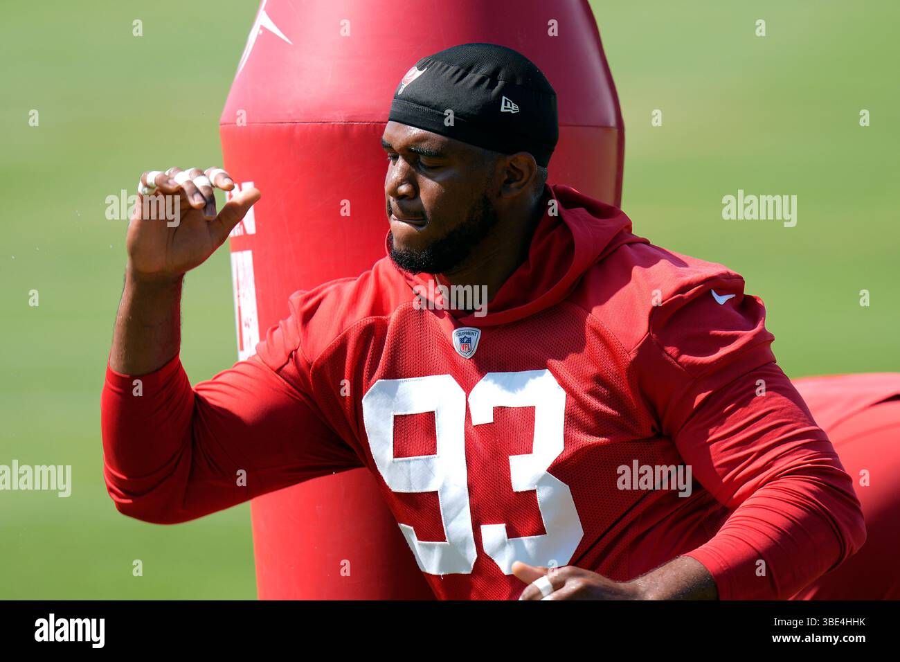 Tampa Bay Buccaneers defensive lineman Eric Banks runs around a blocker ...