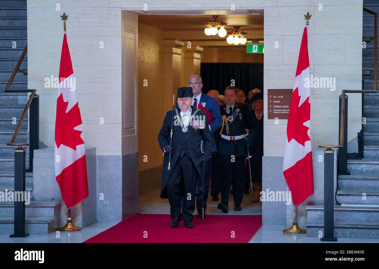 The Usher of the Black Rod, Greg Peters leads the procession to the ...