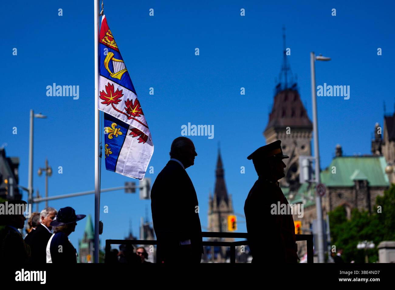 The Sovereign's Flag for Canada flies as King Charles stands on a dais ...